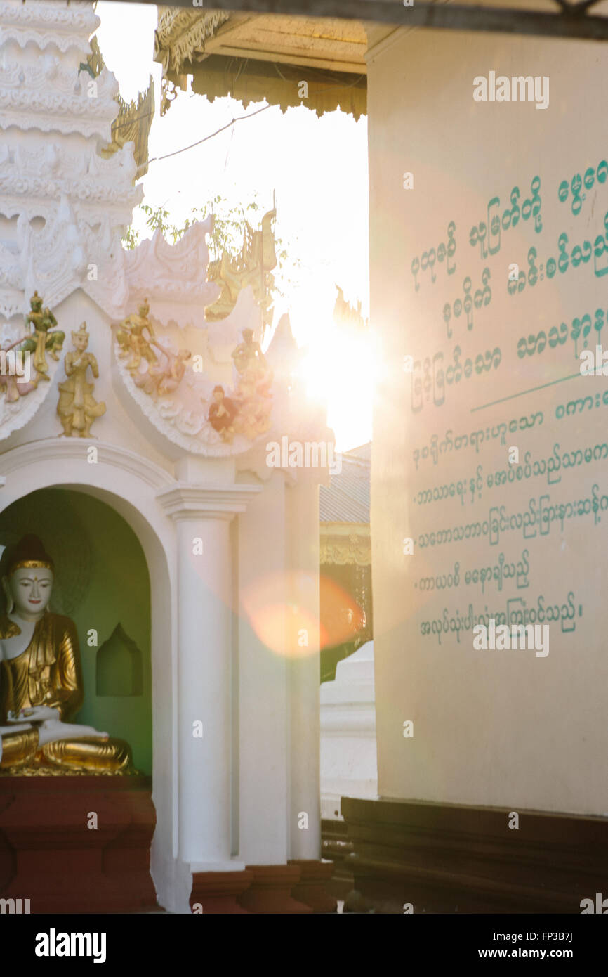 Sunrise sun flare coming through at Shwedagon Pagoda in Yangon, Myanmar ...