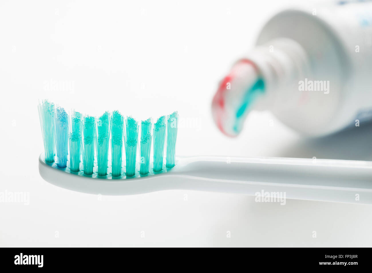 Toothbrush and toothpaste on white background close up Stock Photo - Alamy