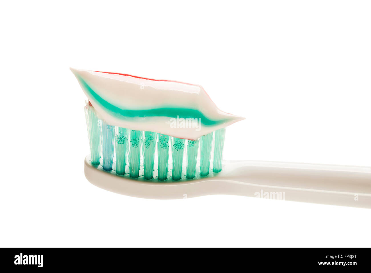 Toothbrush and toothpaste isolated on white close up Stock Photo - Alamy