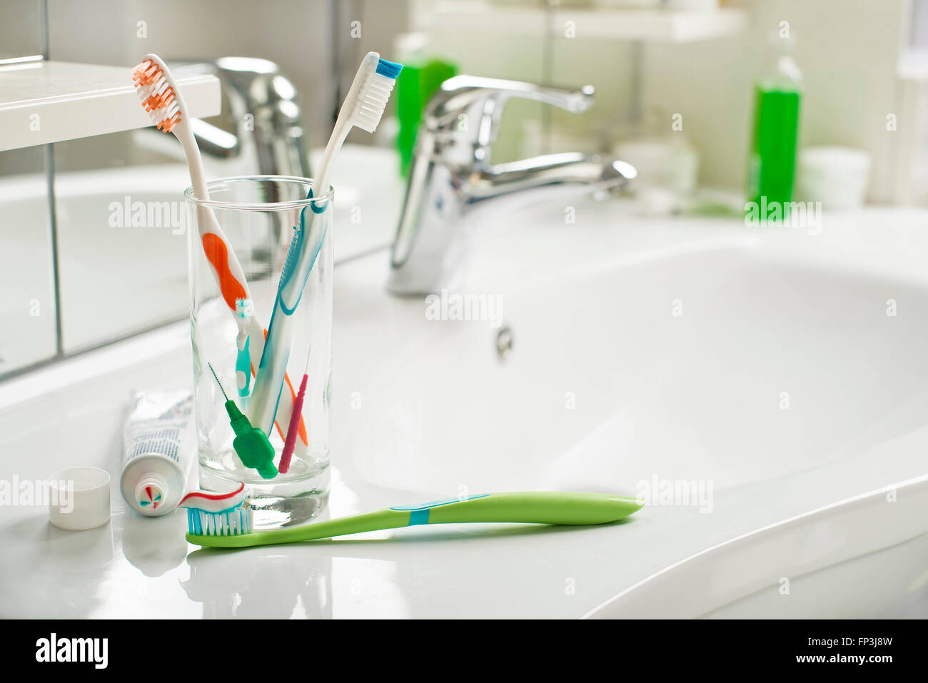 Toothbrush and toothpaste in the bathroom close up Stock Photo - Alamy