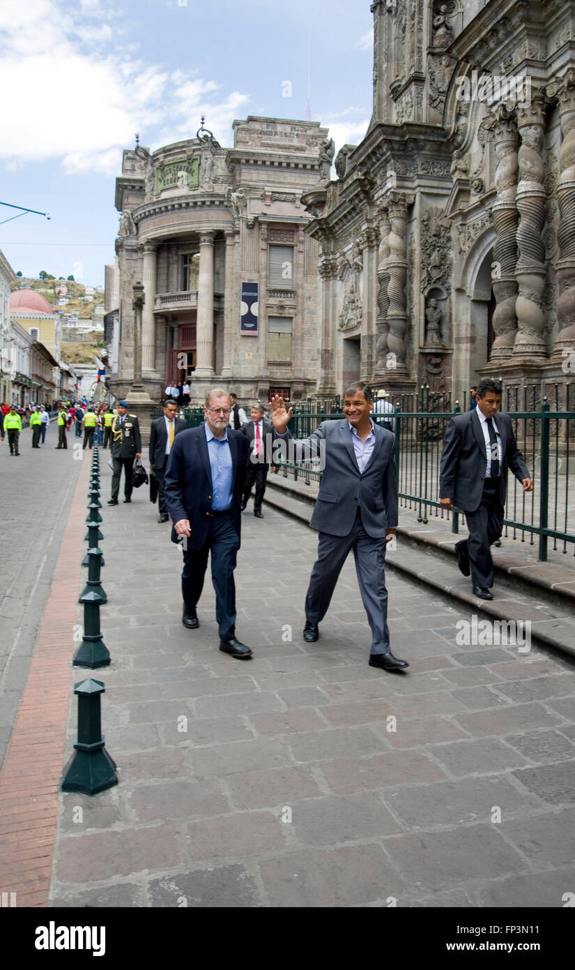 President Rafael Correa of Ecuador walking in Quito with host Peter ...