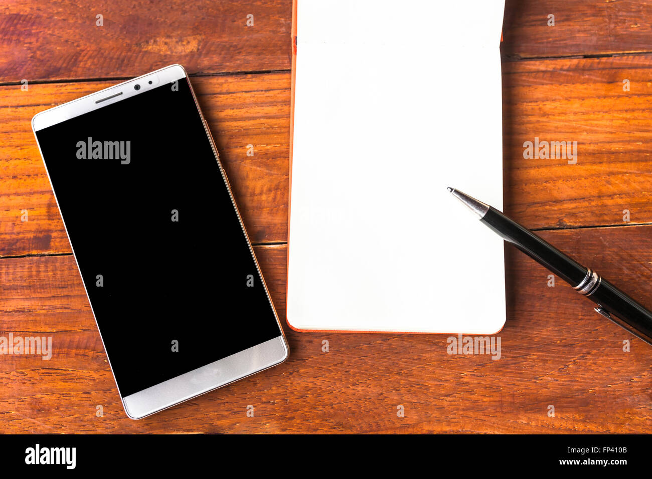 Blank paper with pen and smartphone on wood table concept and Idea for ...