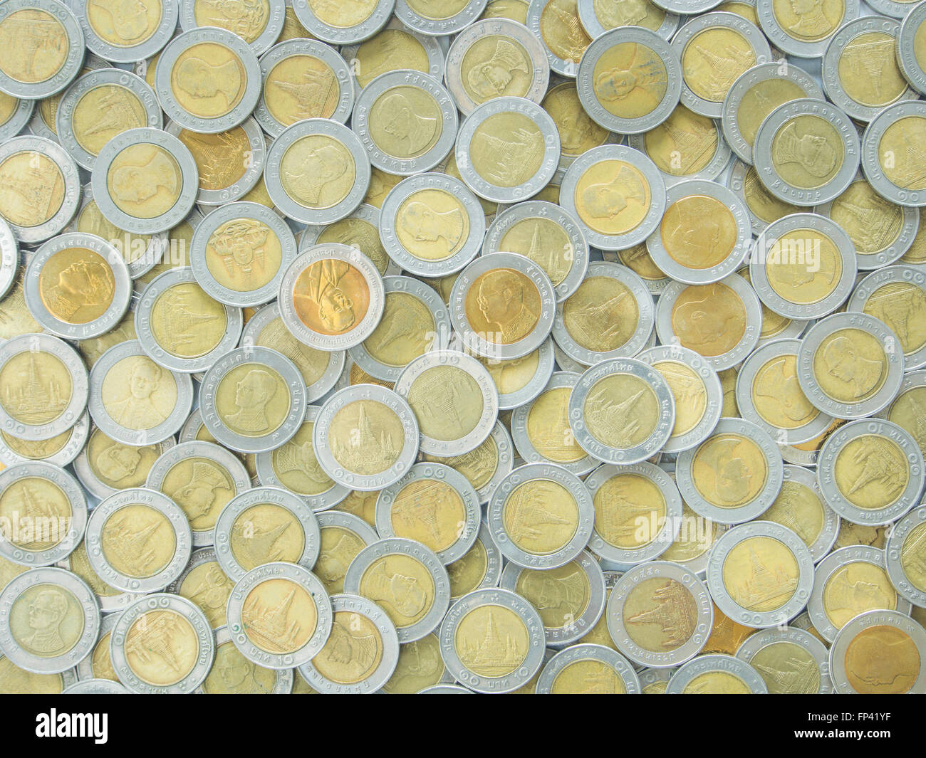 Silver metal coins used to cover the background Stock Photo - Alamy
