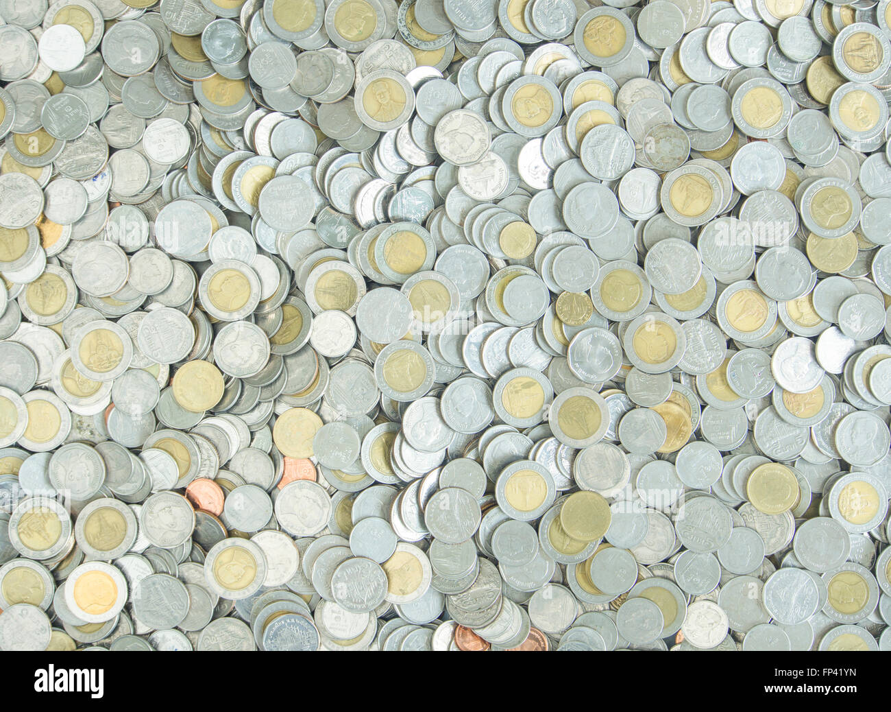 Silver metal coins used to cover the background Stock Photo - Alamy