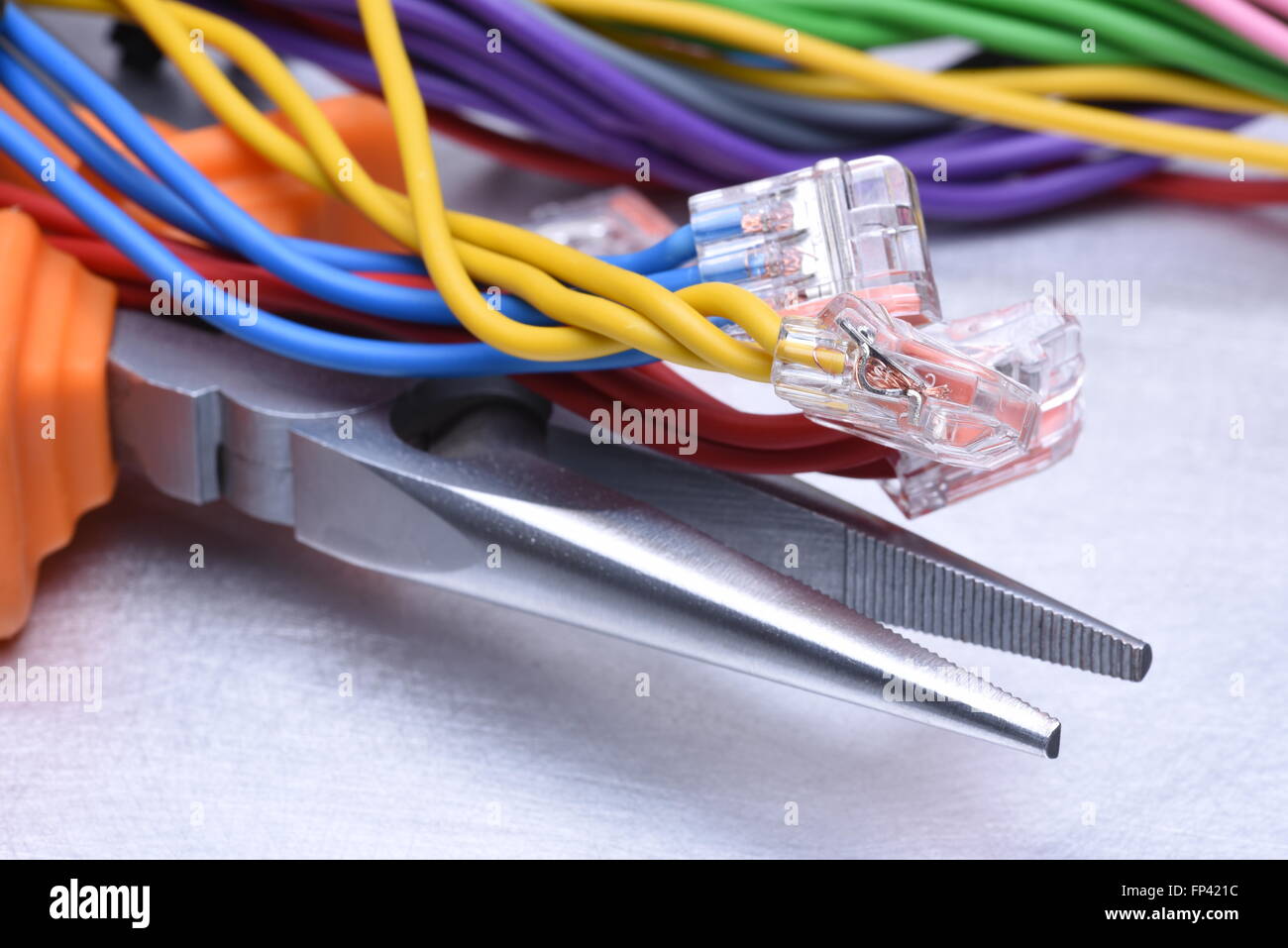 Tools for electrician and cables on grey metal surface Stock Photo - Alamy