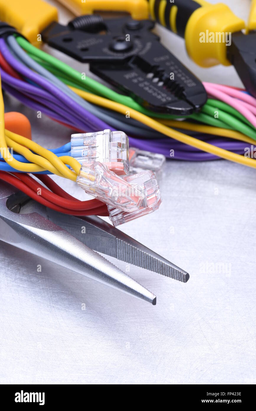 Tools for electrician and cables on grey metal surface Stock Photo - Alamy