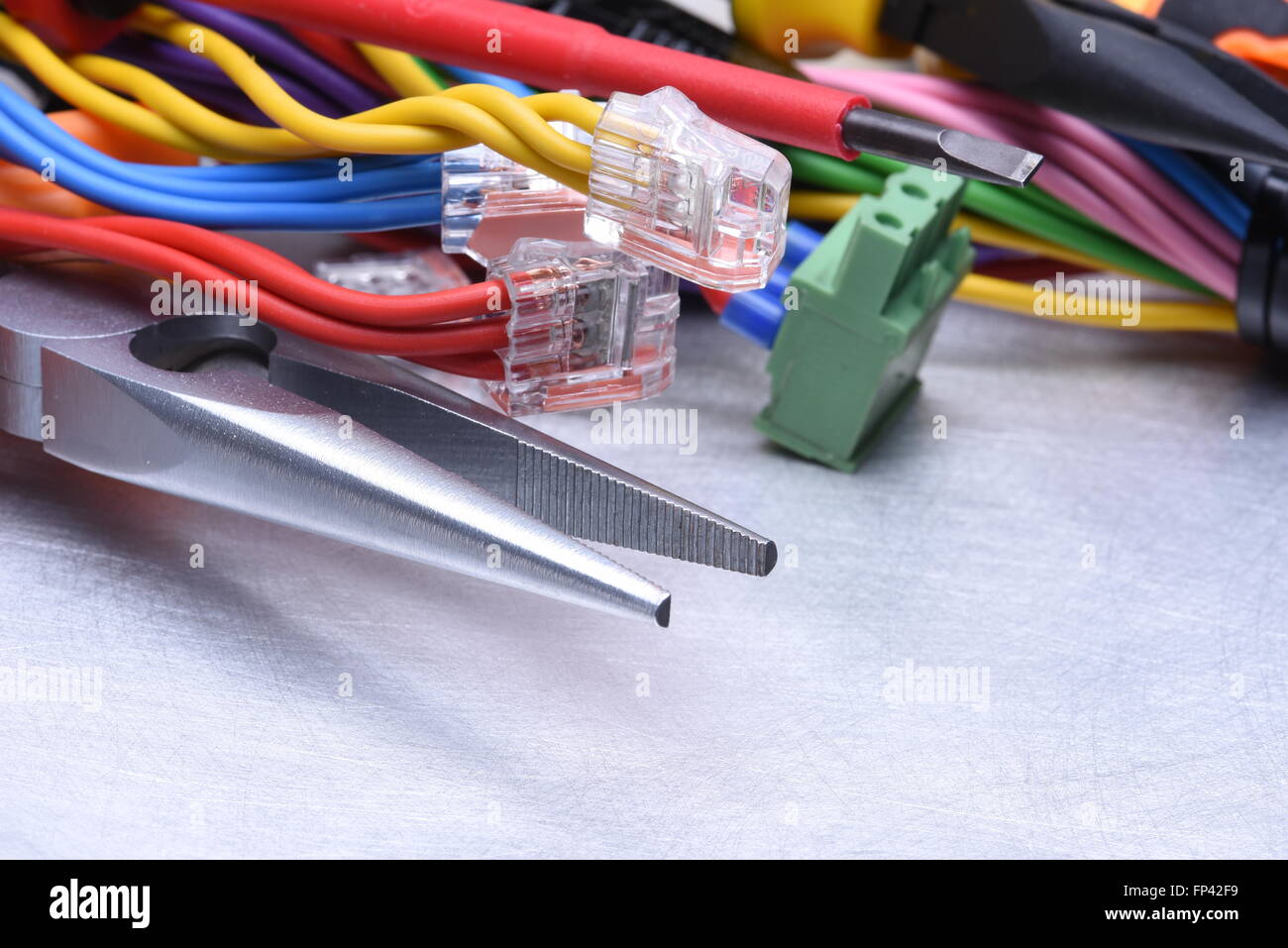 Tools for electrician and cables on grey metal surface Stock Photo - Alamy