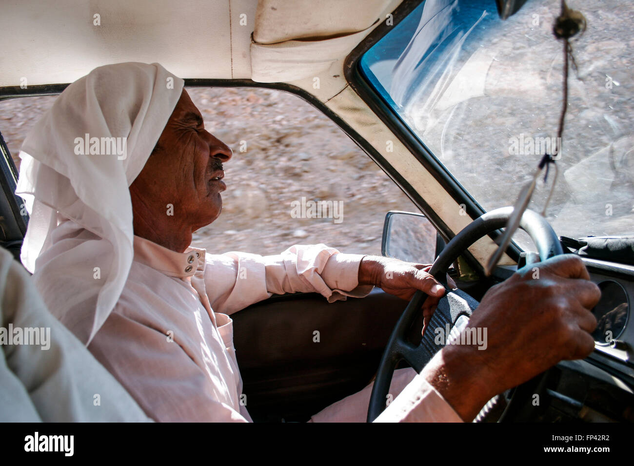 PORTRAIT OF AN EGYPTIAN TAXI DRIVER WEARING TRADITIONAL CLOTHES AND ...