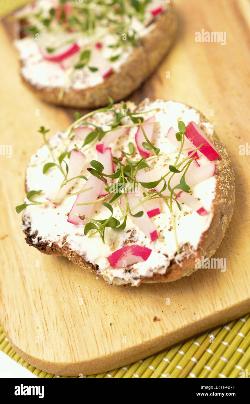 Whole grain bread with curd and radishes and frresh cress Stock Photo ...