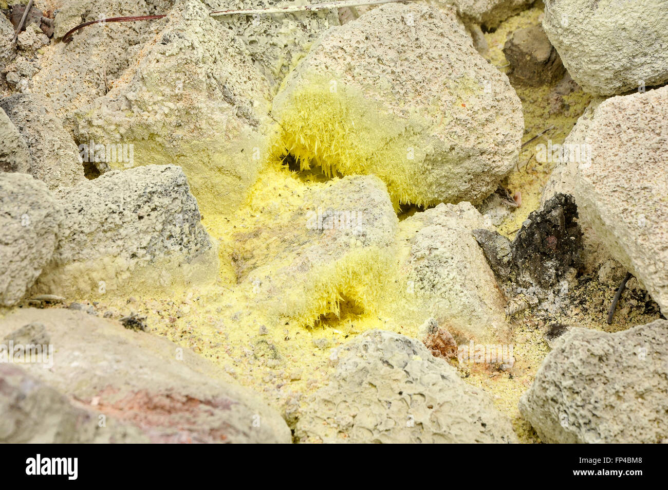 Yellow Sulfur crystals on rocks Stock Photo - Alamy