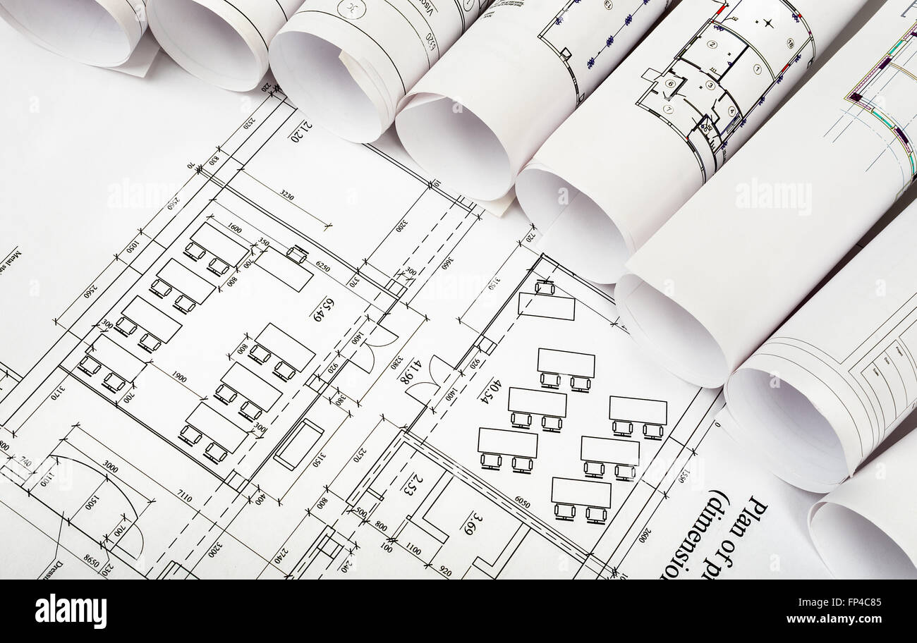 Blueprints and rolls of blueprints, side view. Building concept Stock ...