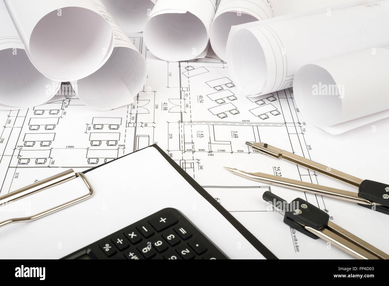 Rolls of blueprints with calculator and folder. Building concept Stock ...