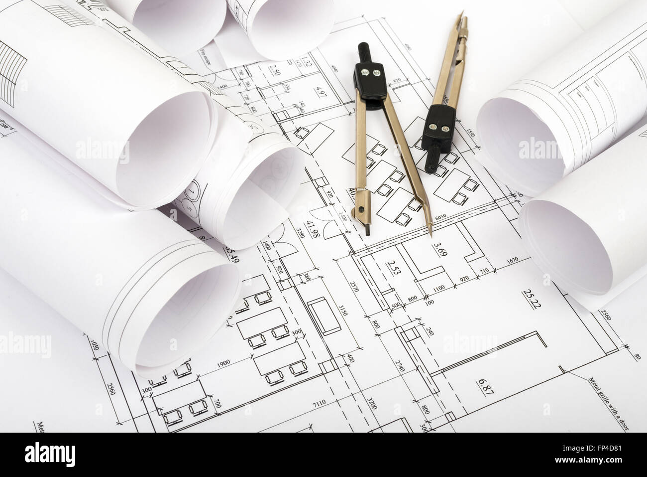 Blueprints and rolls of blueprints with dividers. Building concept ...