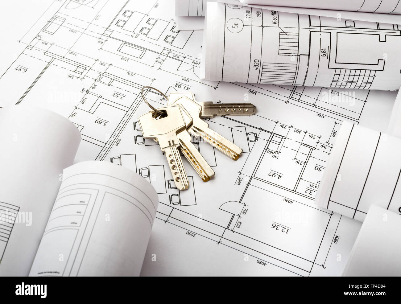 Blueprints and rolls of blueprints with keys. Building concept Stock ...
