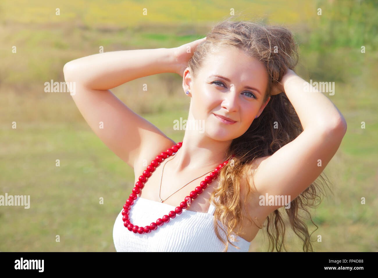 Portrait of a beautiful young woman outdoors in the summer Stock Photo ...
