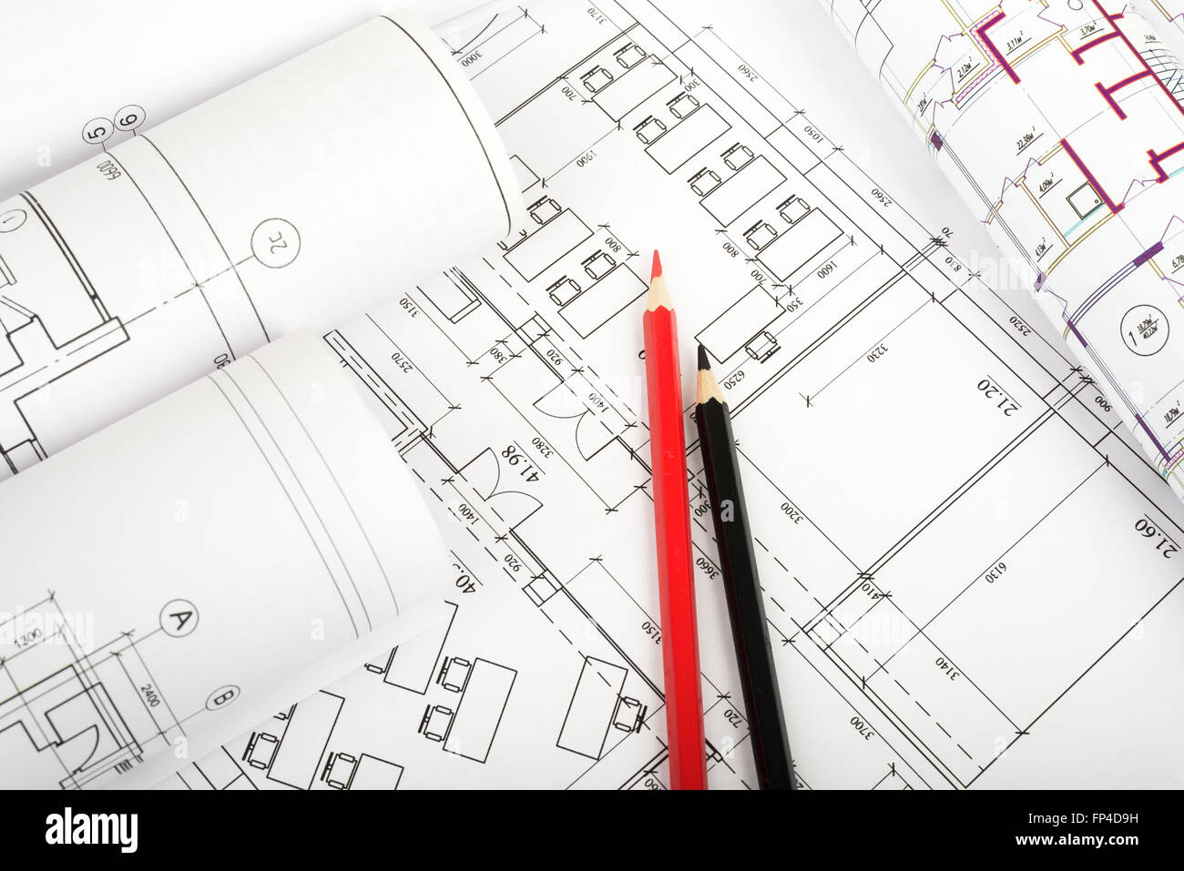 Architecture plan and rolls of blueprints with crayons. Building ...