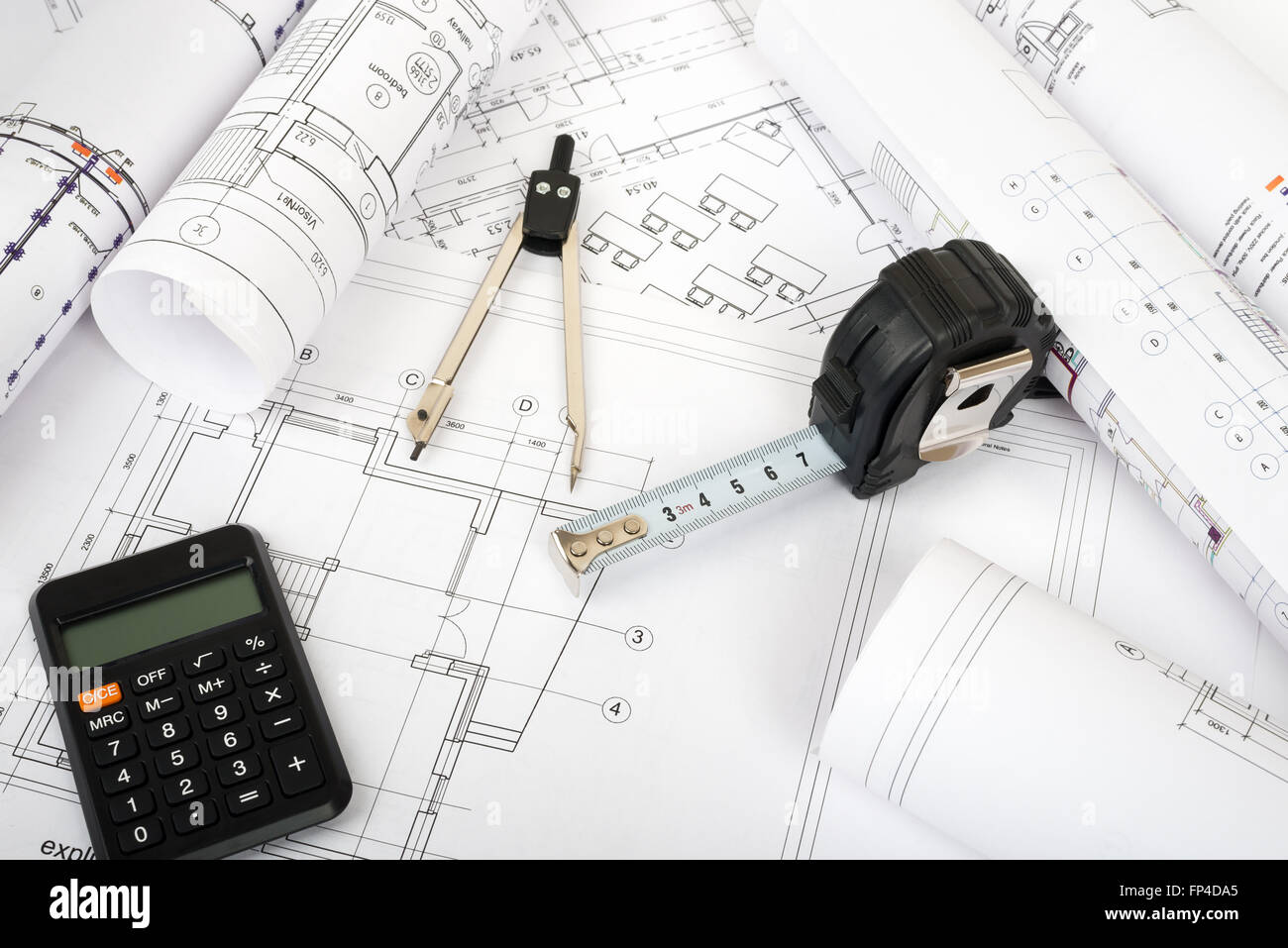 Architecture plan and rolls of blueprints with meter. Building concept ...