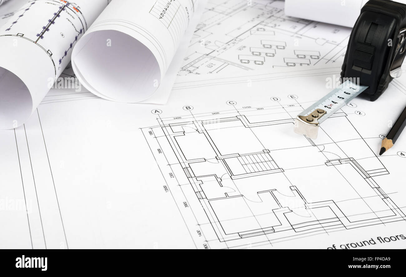 Architecture plan and rolls of blueprints with meter. Building concept ...