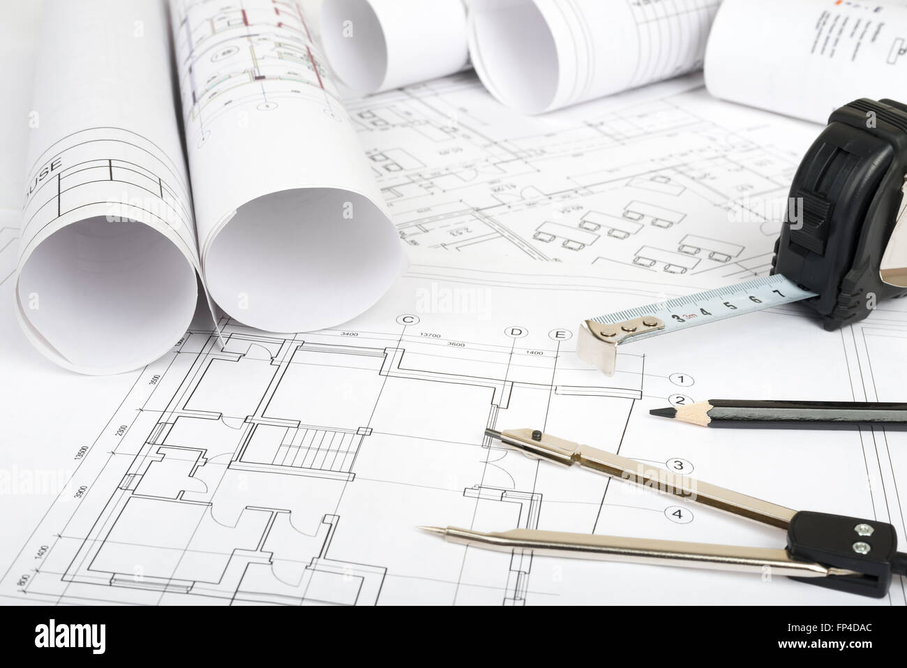 Architecture plan and rolls of blueprints with meter. Building concept ...