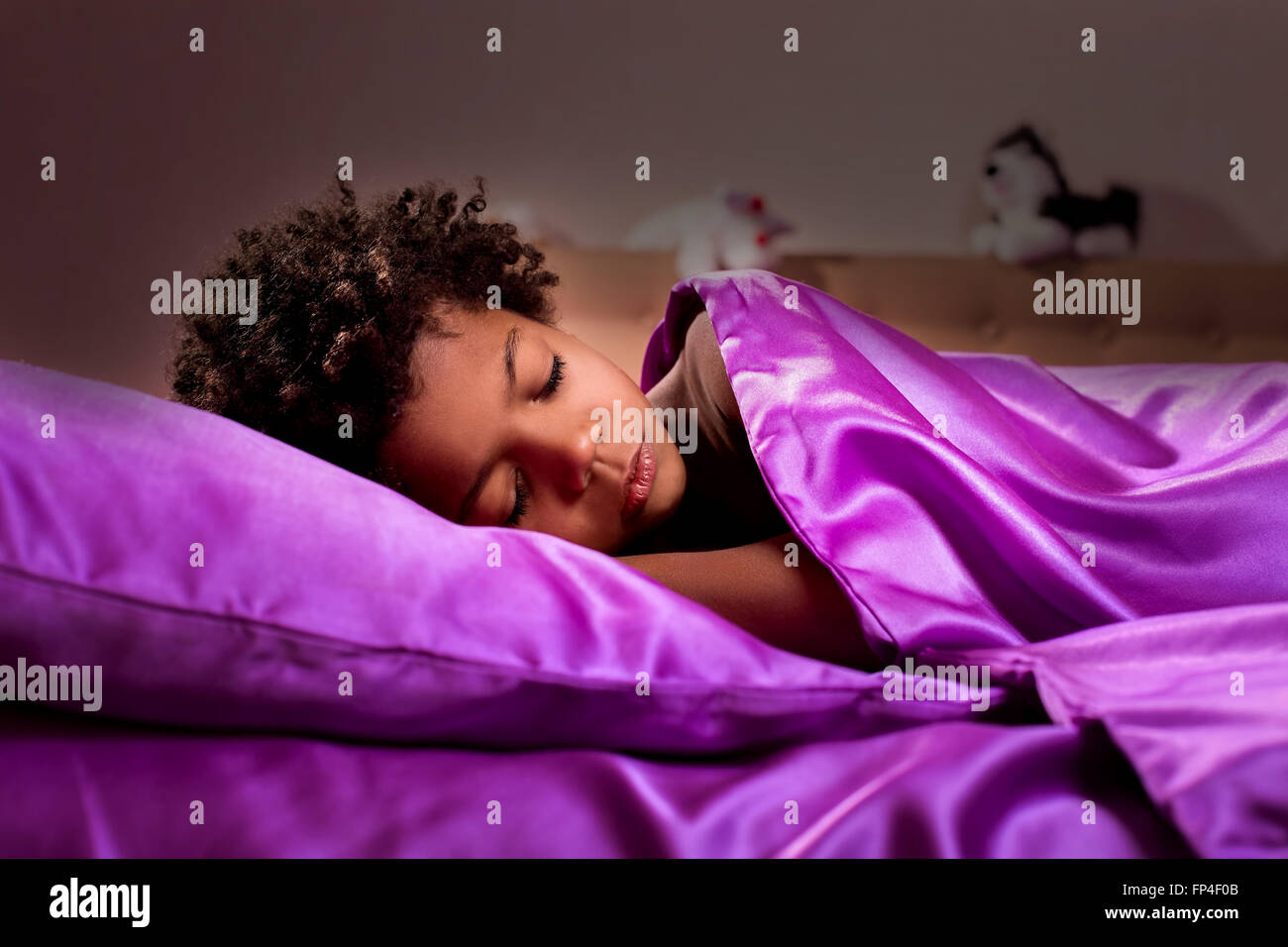 Black kid sleeping at night. Midnight at afro boy's bedroom. Darkness ...