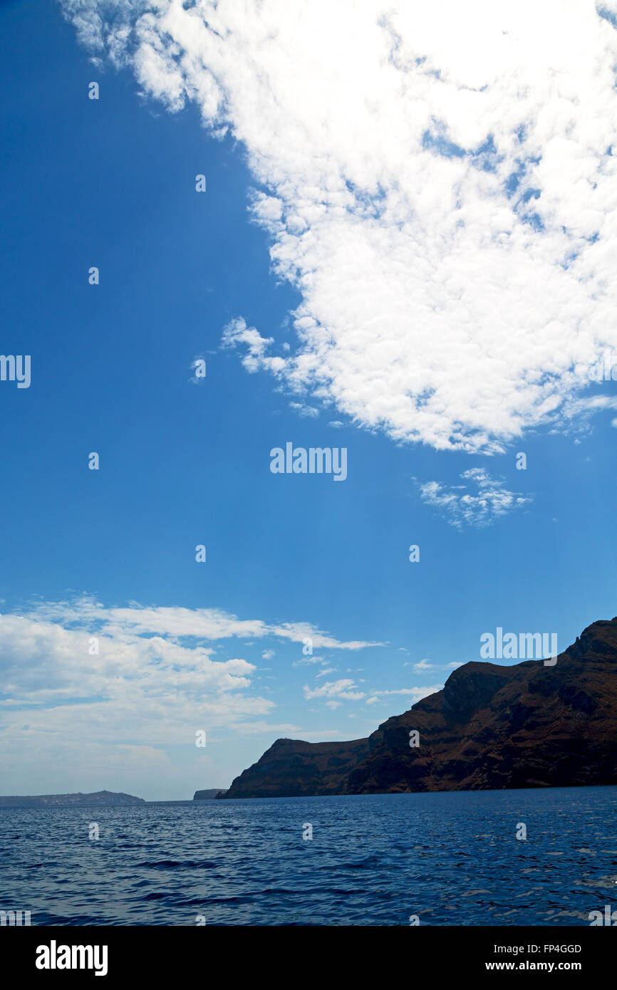in the cyclades sea of greece sun light and backlight from the clouds ...