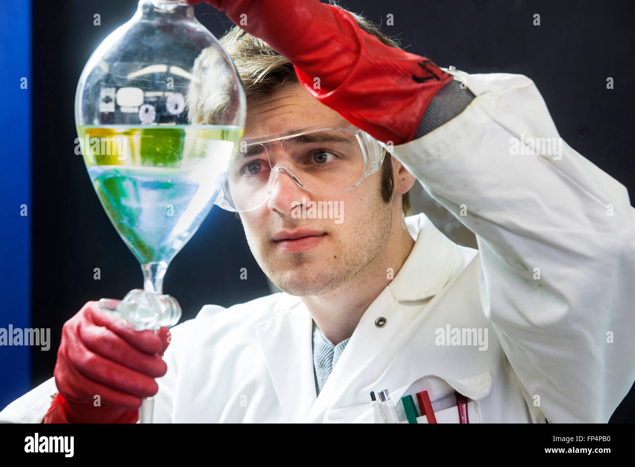 Student in a laboratory during a experiment, Heinrich-Heine-University ...