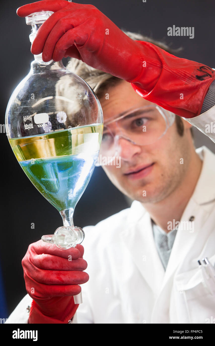Student in a laboratory during a experiment, Heinrich-Heine-University ...