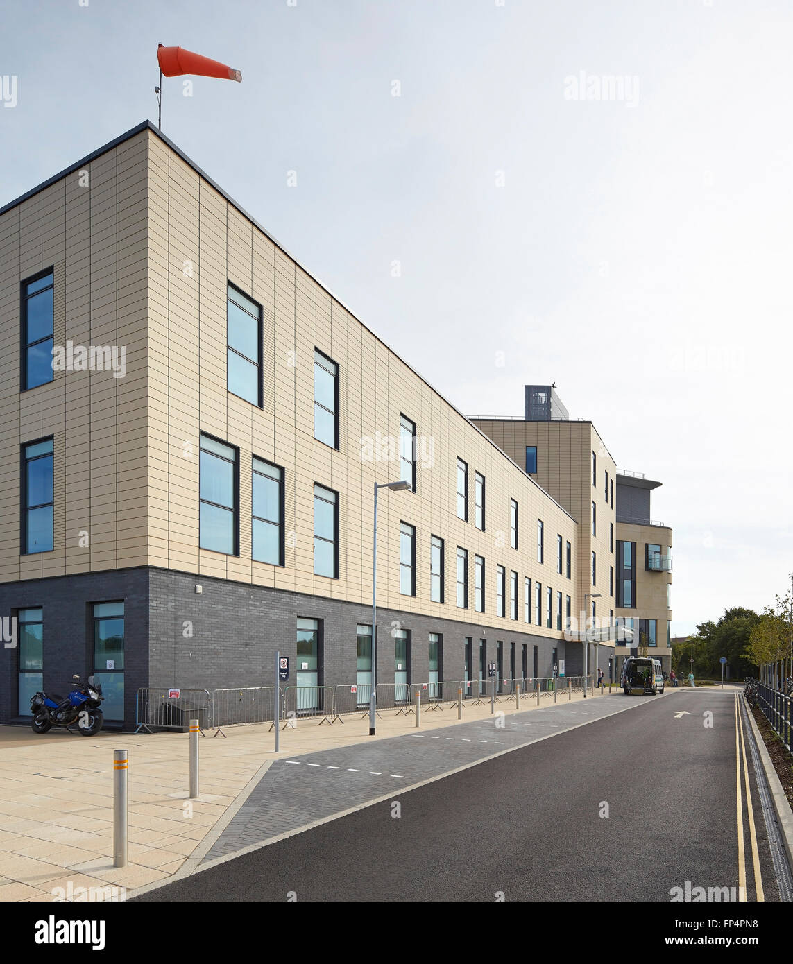 Perspective along approach with building facade. Southmead Hospital ...
