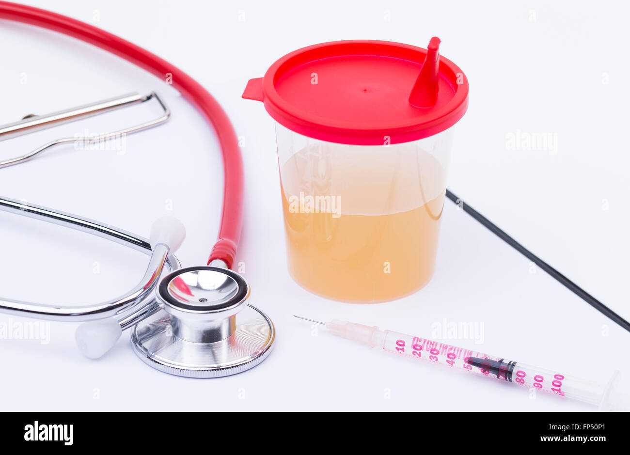 Medical test with urine, Stethoscope and injection Stock Photo - Alamy