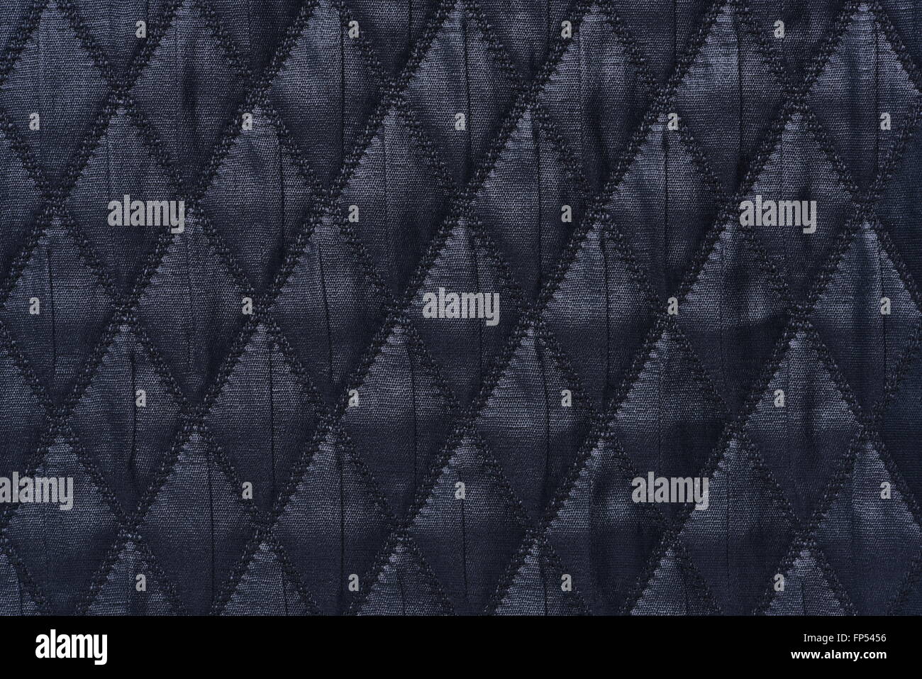 Black quilted fabric as background Stock Photo - Alamy