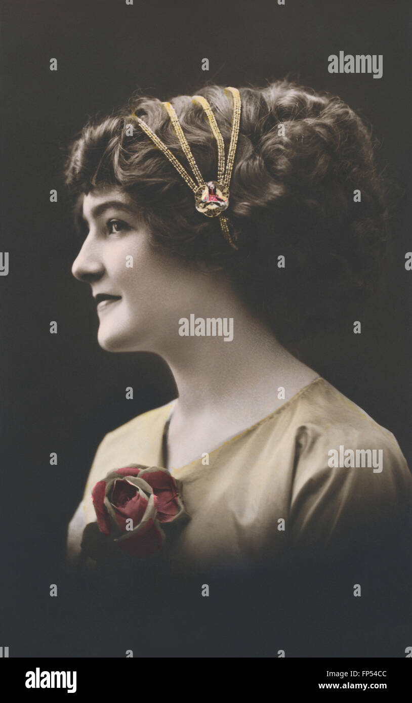 Hand-coloured sepia postcard of a beautiful Edwardian lady in profile ...