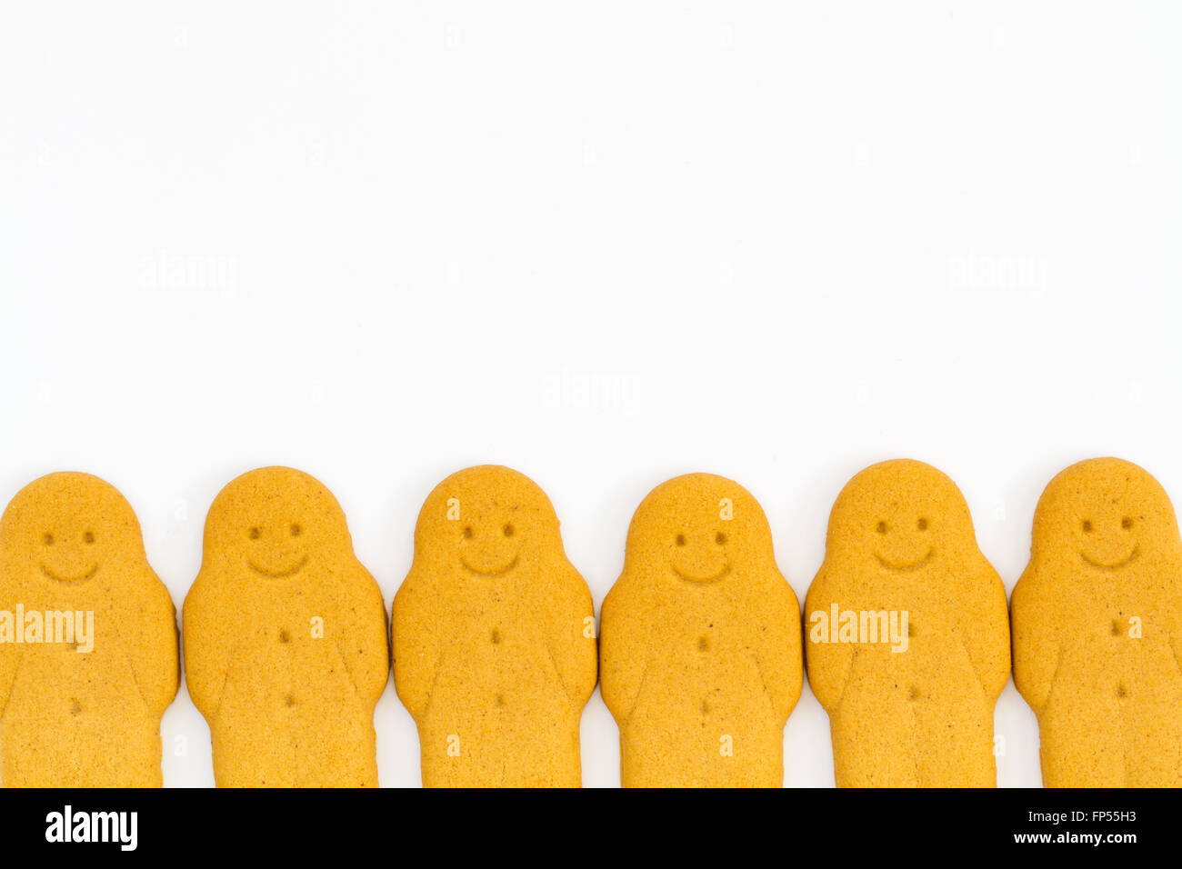 A row of happy gingerbread men on an isolated white background Stock ...