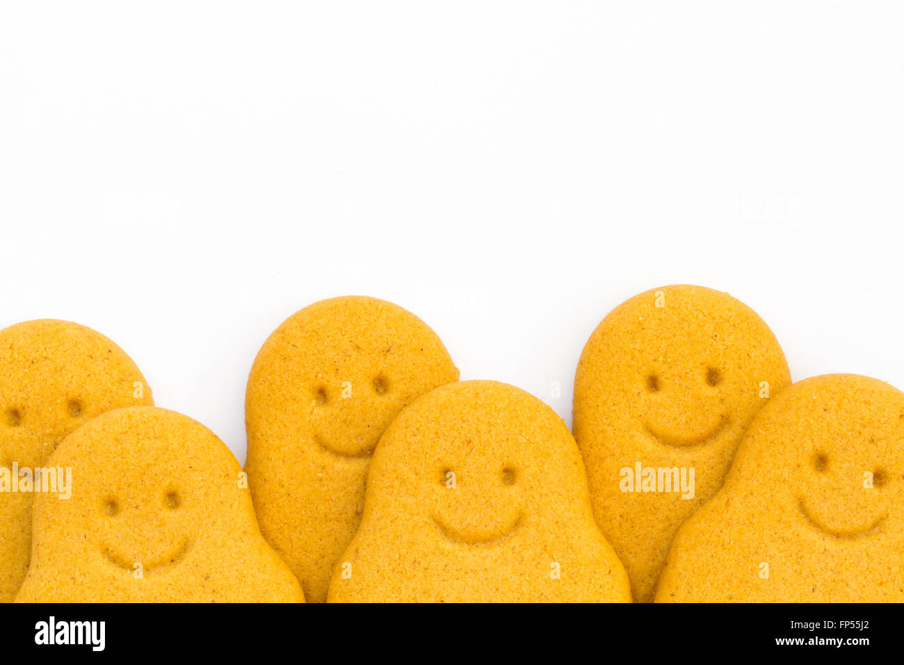 A row of happy gingerbread men on an isolated white background Stock ...