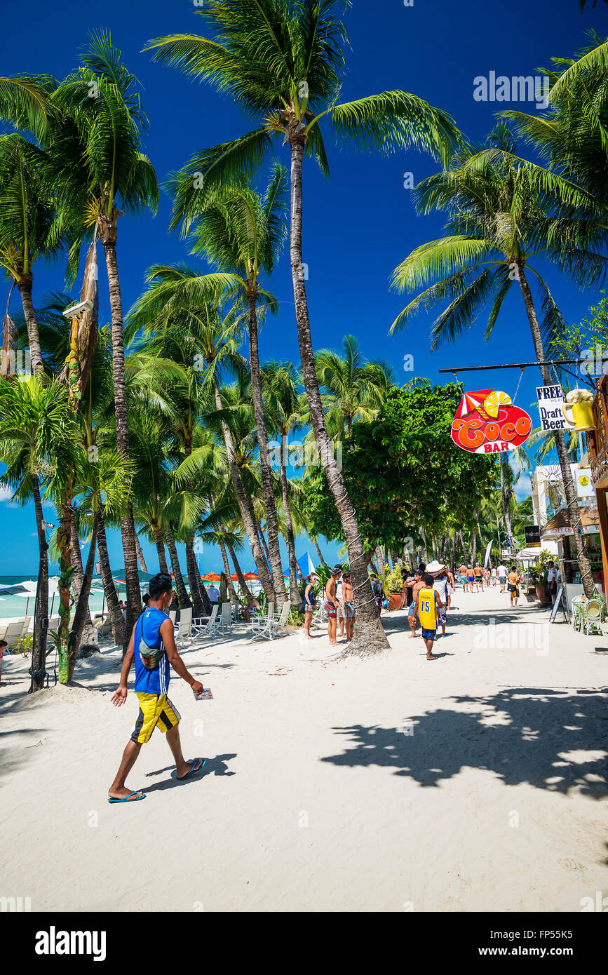 tourists on station 2 main beach busy shop restaurant street in boracay ...