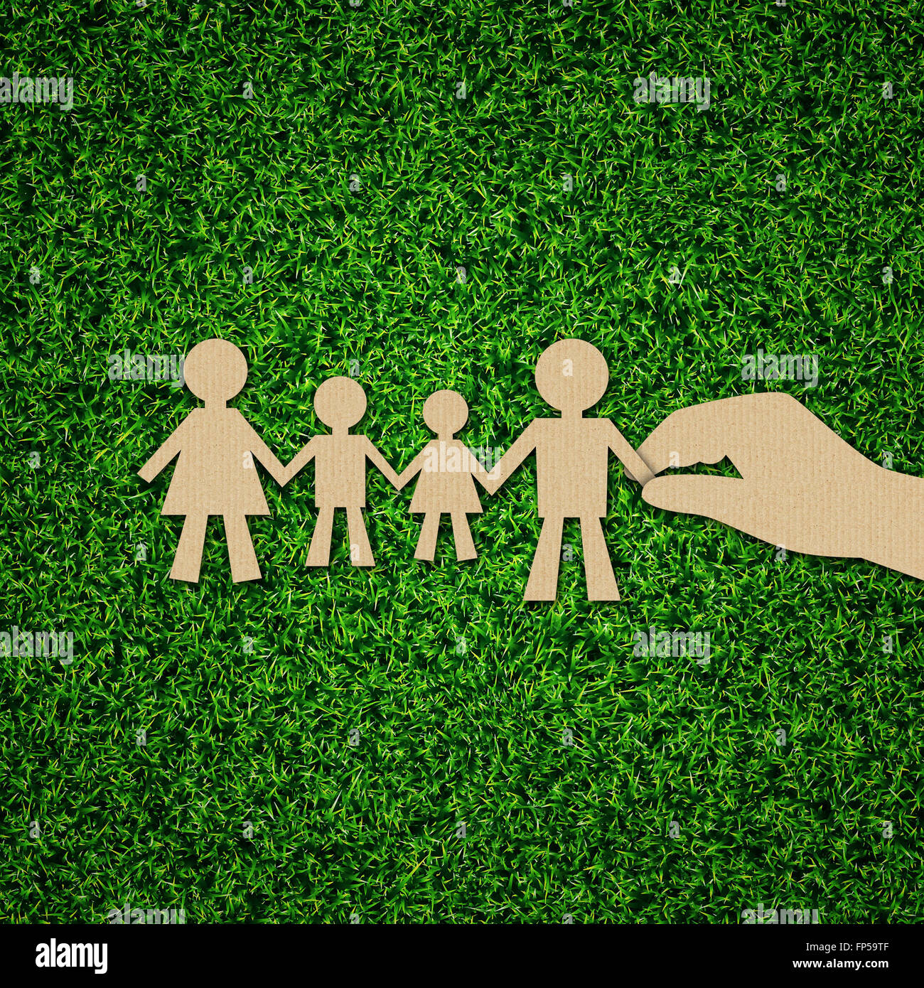 Family concept illustration with cardboard cut out on grass Stock Photo ...