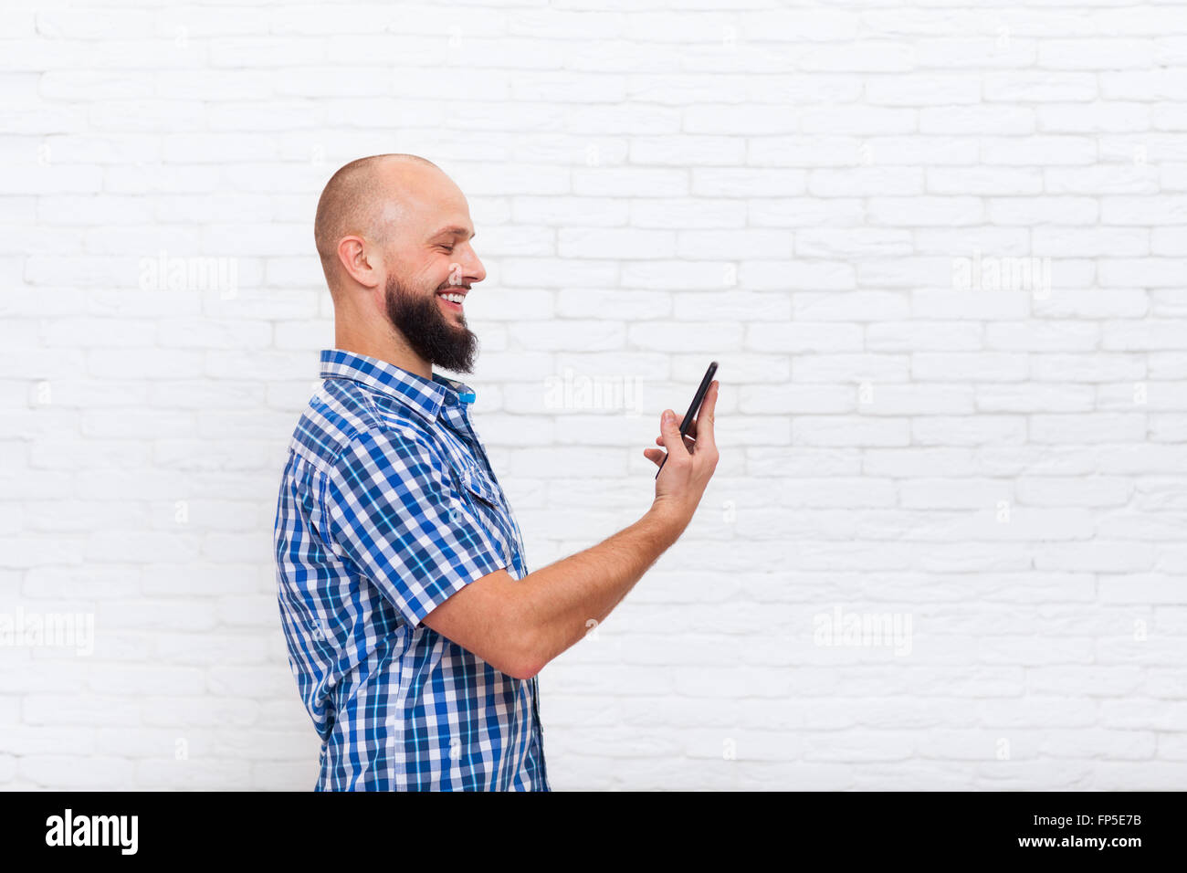 Casual Bearded Man Using Cell Smart Phone Happy Smile Stock Photo - Alamy