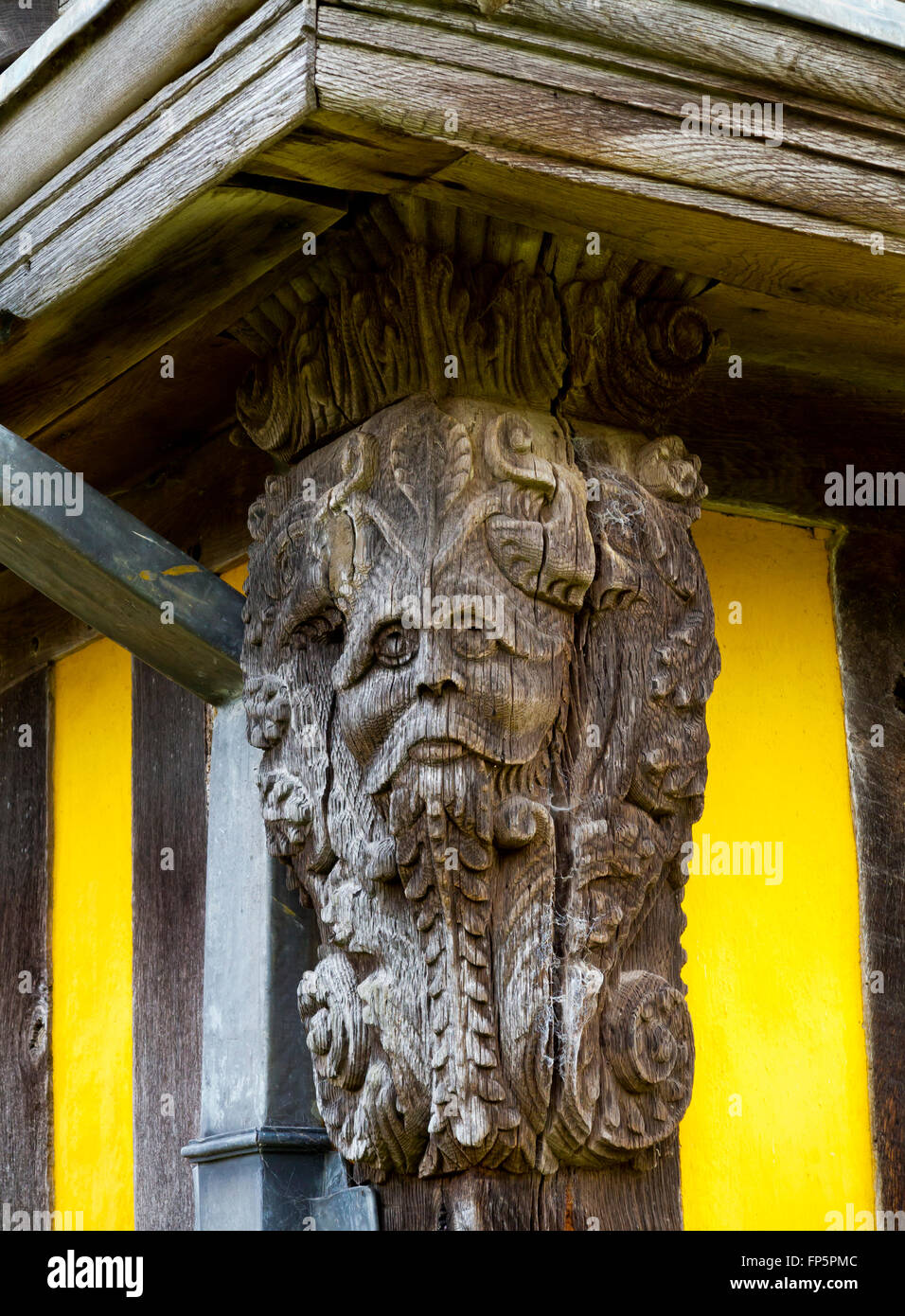 Carved wooden devil on the 17th century wood and plaster gatehouse at ...