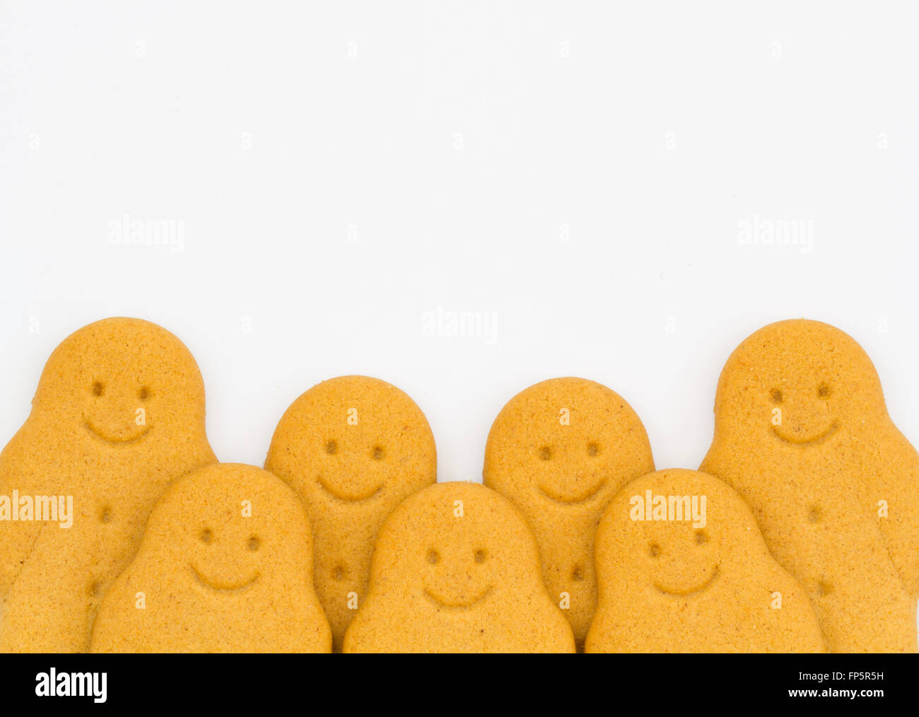 A row of happy gingerbread men on an isolated white background Stock ...