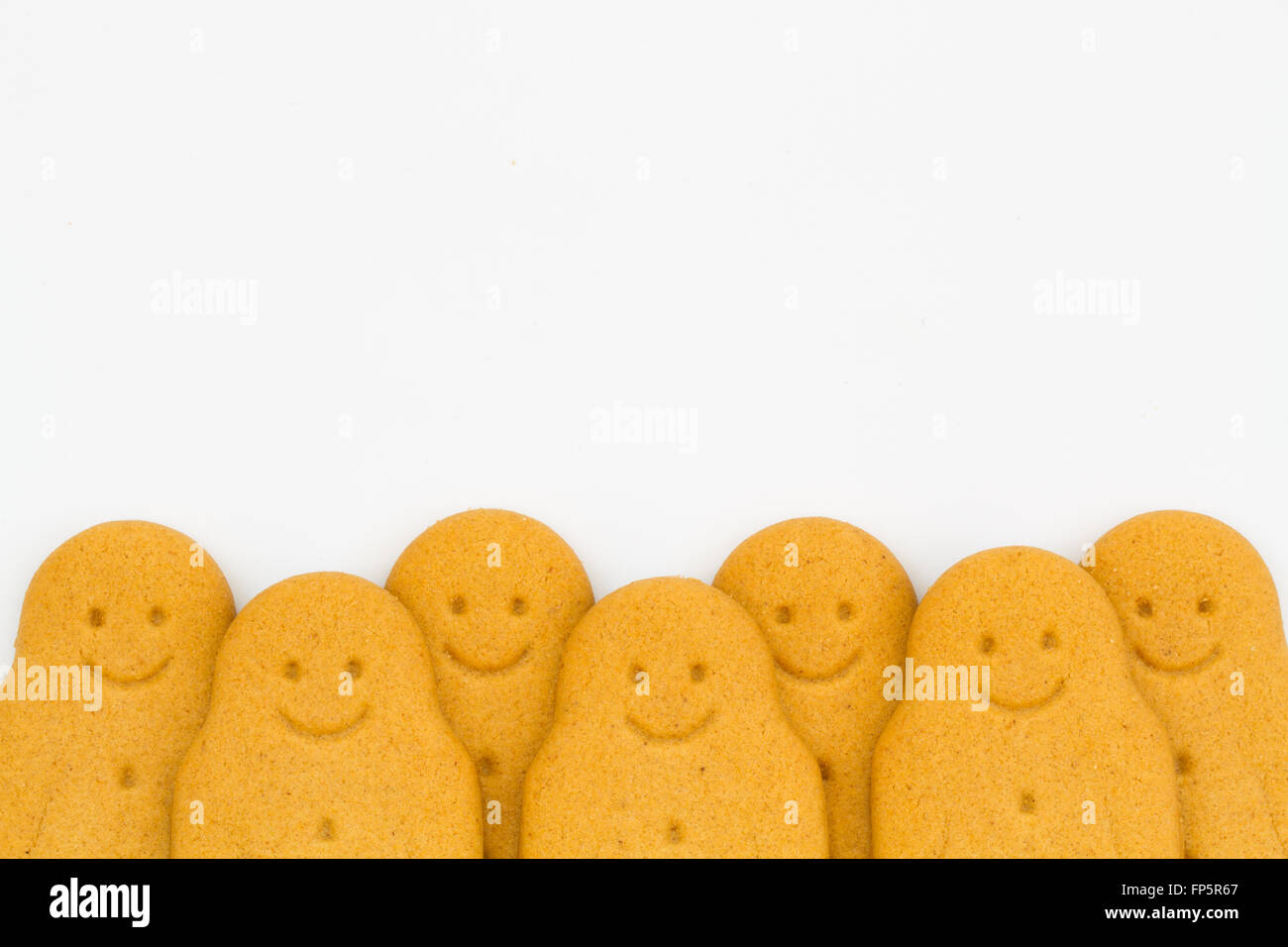 A row of happy gingerbread men on an isolated white background Stock ...