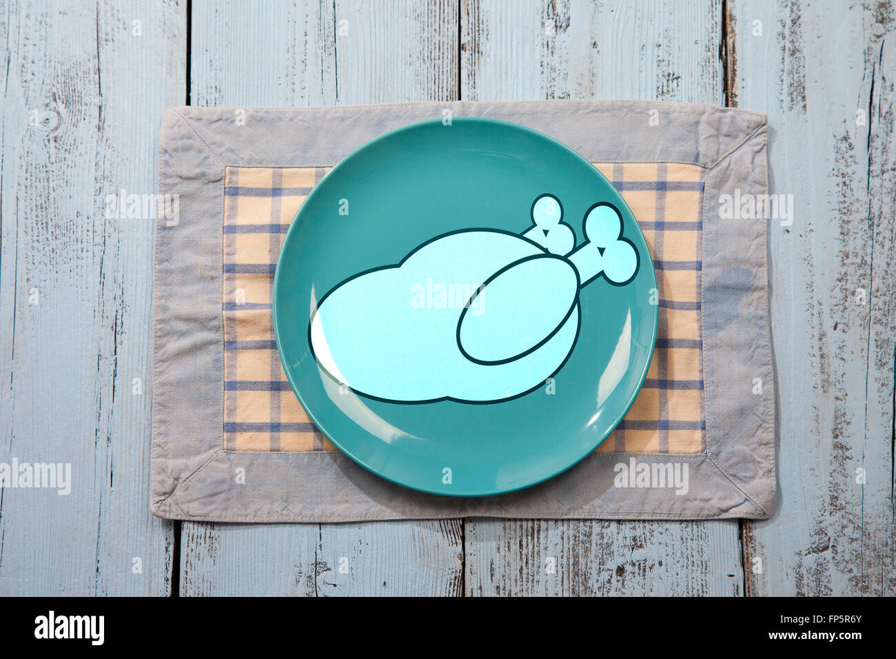 Empty plate with chicken meat sign on light blue wooden background ...