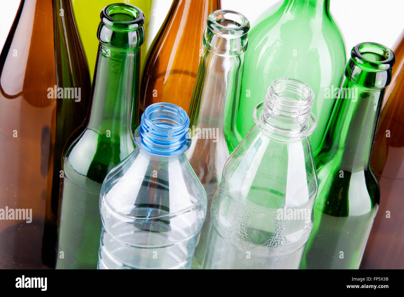 Empty bottles close-up isolated on white background Stock Photo - Alamy