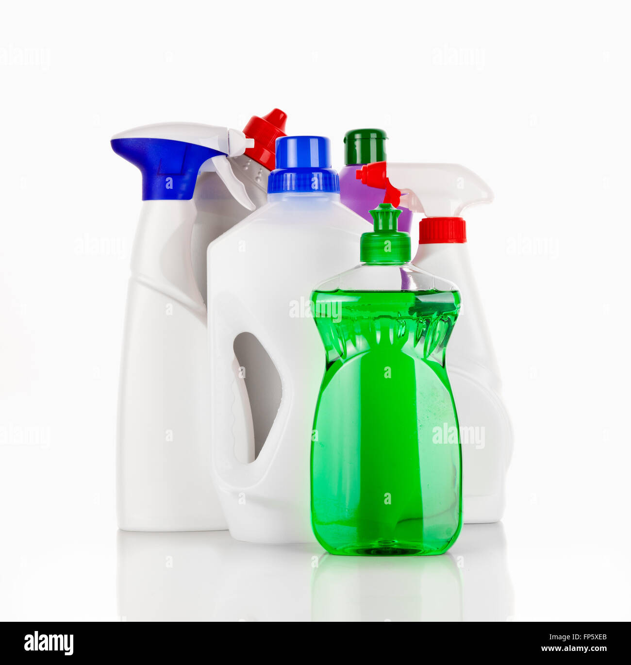 Various bottles with cleaning supplies isolated on white background ...