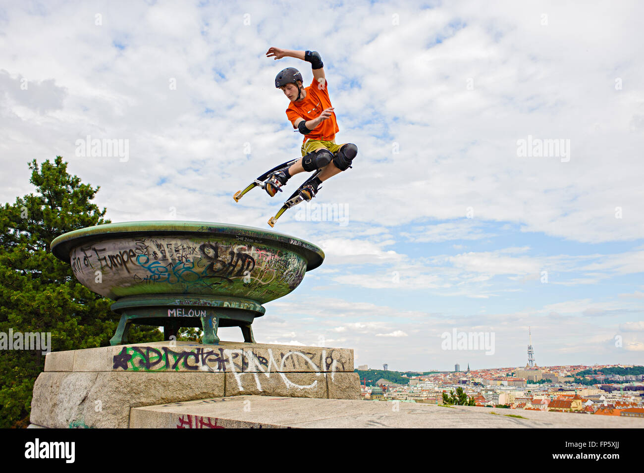 Young guy on a jumping boots Stock Photo - Alamy