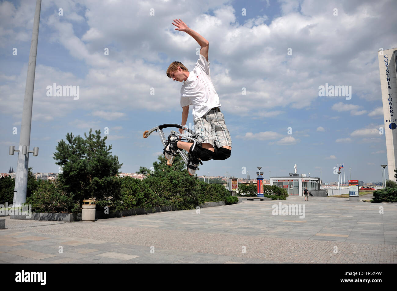 Young man on a jumping boots Stock Photo - Alamy