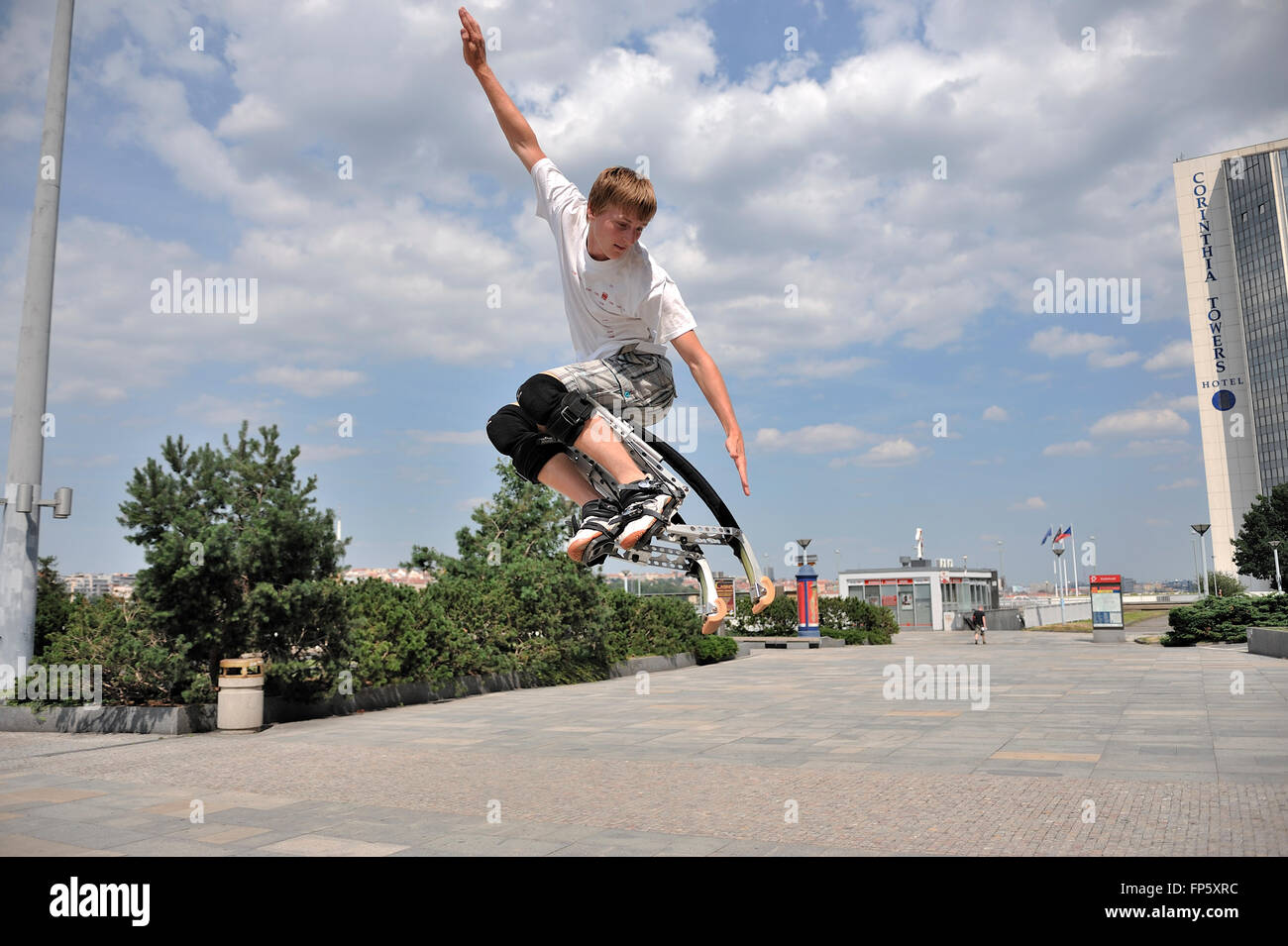 Young man on a jumping boots Stock Photo - Alamy