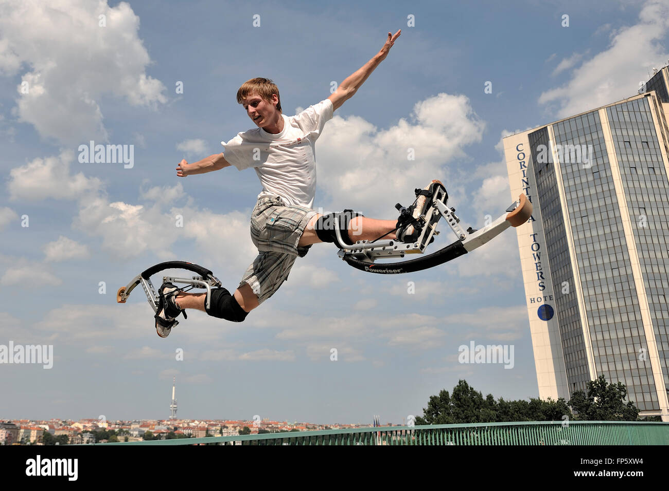 Young man on a jumping boots Stock Photo - Alamy