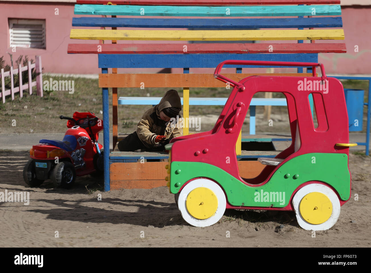 children play on the playground. early spring Stock Photo - Alamy