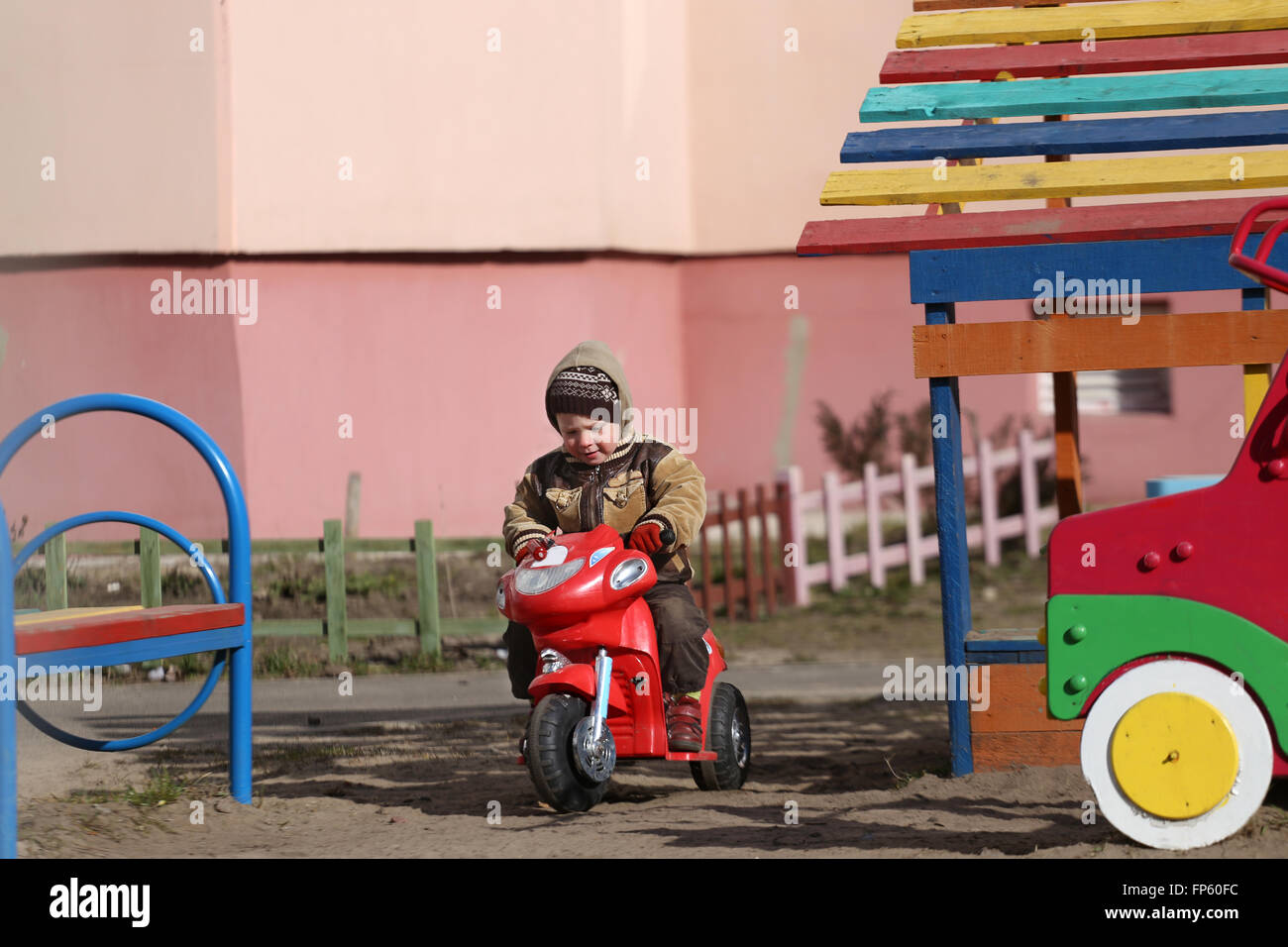 children play on the playground. early spring Stock Photo - Alamy