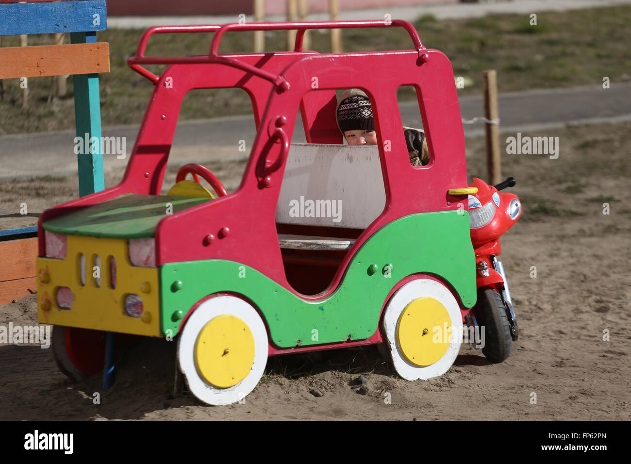 children play on the playground. early spring Stock Photo - Alamy