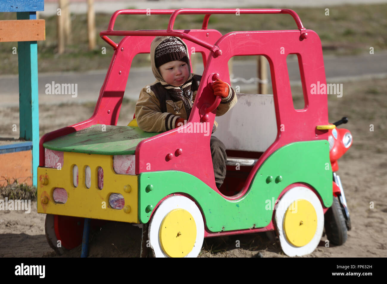 children play on the playground. early spring Stock Photo - Alamy